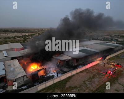 230612 -- JAHRA KUWAIT, June 12, 2023 -- Firefighters battle a fire at ...