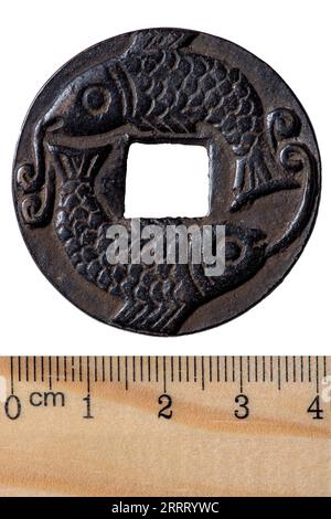 Vintage Chinese copper coin with a square hole. Reverse. Isolated on ...