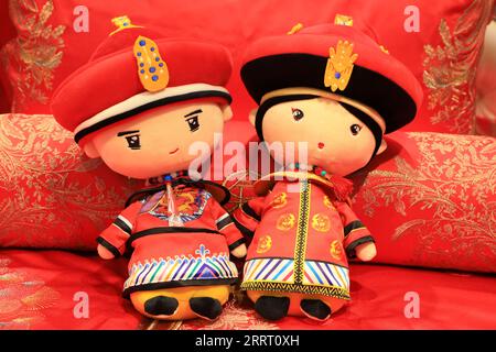 Traditional Chinese style dolls are on the bed Stock Photo - Alamy