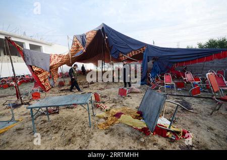 230731 -- BAJAUR PAKISTAN, July 31, 2023 -- Security personnel inspect ...