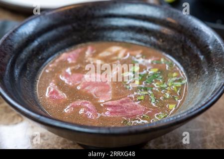 Thai noodle with rare sliced wagyu meat in blood soup Stock Photo - Alamy