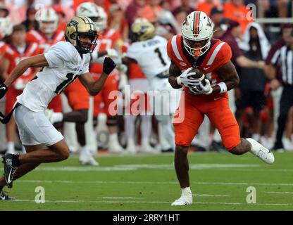 Virginia Tech's Jaylin Lane (83) goes by Terry Jones (1) for a ...