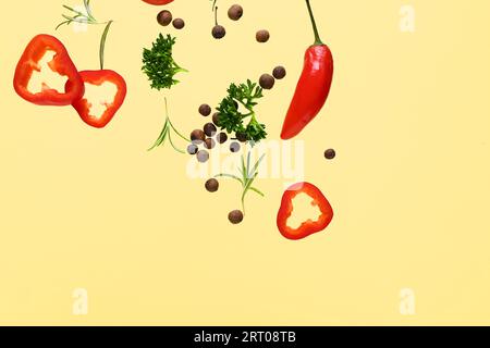 Flying spices on color background with space for text Stock Photo - Alamy