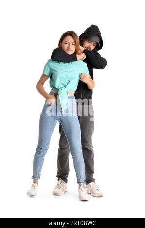 Woman defending herself against robber on white background Stock Photo ...
