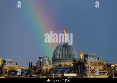 An incipient rainbow above the glass dome of the Academy of Arts with ...