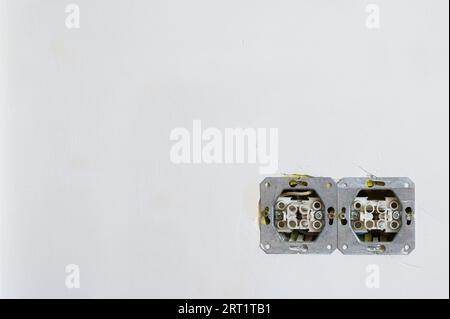Double open euro electrical socket on a grungy gray wall. Close-up ...