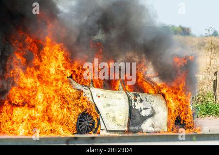 Car crash and fire flames with black smoke Stock Photo - Alamy