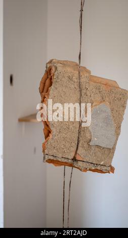 apartment renovation piece of wall hanging on reinforcement Stock Photo ...