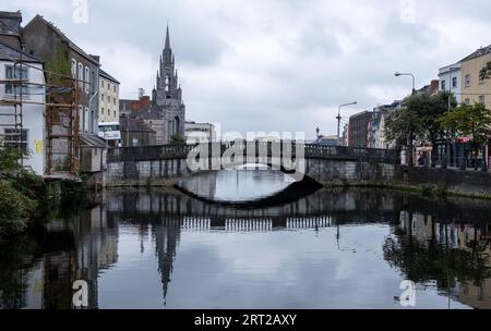 Urban cityscape of cork city with holy trinity church and lee river ...