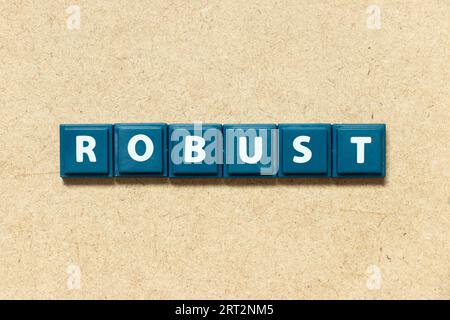 Tile alphabet letter with word ability in red color rack on wood ...