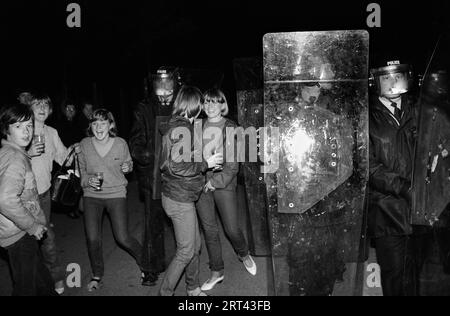 Toxteth Riots 1980s UK. A teen is arrested for rioting, being help by a ...