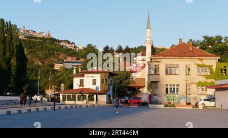 Square with Inat Kuca restaurant, minaret and mansion style property ...