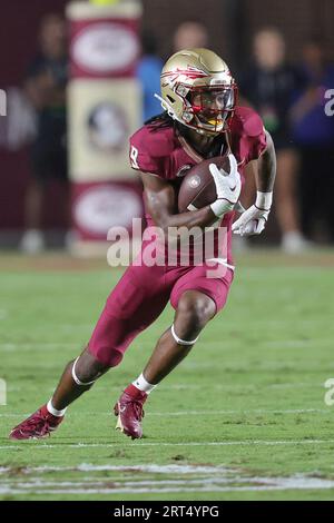 Florida State running back Lawrance Toafili (9) rushes for yardage past ...