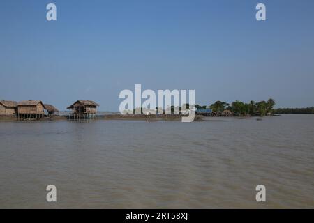 Houses are seen at the edge of the Sundarbans coastal area in Sathkhira ...
