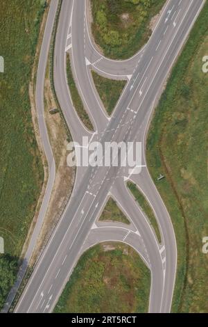 Aerial view from a drone of an intersection with cars in the colorful ...