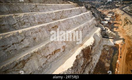 Ledges and slopes of highway under construction Stock Photo - Alamy