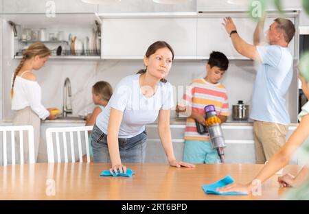 Big family members cleaning their house Stock Photo - Alamy
