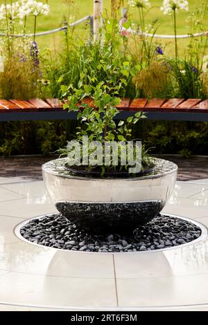 Patio planter and water feature Stock Photo - Alamy