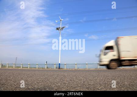 Electric towers and moving vehicles Stock Photo - Alamy