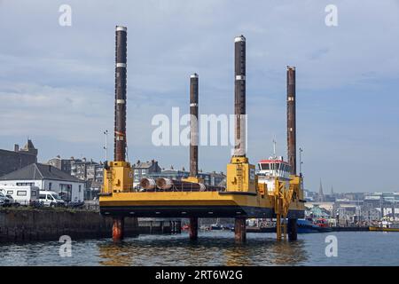 Jacklad 650 a bright yellow barge, nautical platform, berthed in the ...