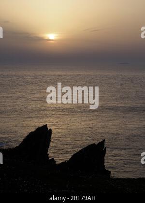 Sunset over Grassholm from Skokholm, Pembrokeshire, Wales Stock Photo ...