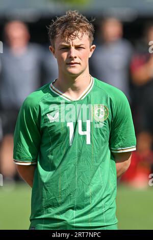 Kaylem Harnett (14) of Ireland pictured fighting for the ball with Zaïd ...