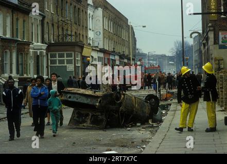 Brixton Riots 1980s UK. The day after firefighter making sure the ...