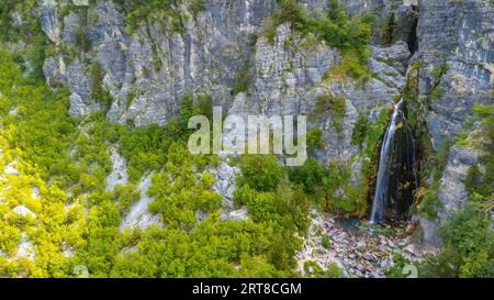 Aerial view of Grunas Waterfall in Theth National Park, Albania ...