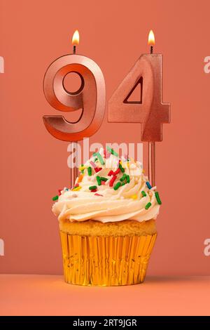 Candle number 94 - Cake birthday in blue background Stock Photo - Alamy