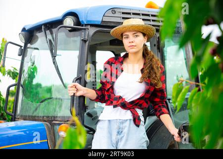 Woman tractor hat driver farm red rural vehicle agriculture outdoor ...