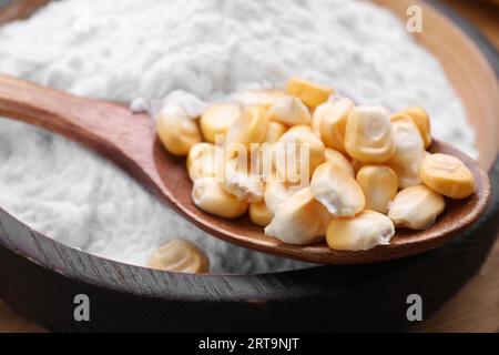 Bowl with corn starch and kernels on light grey table, closeup Stock ...