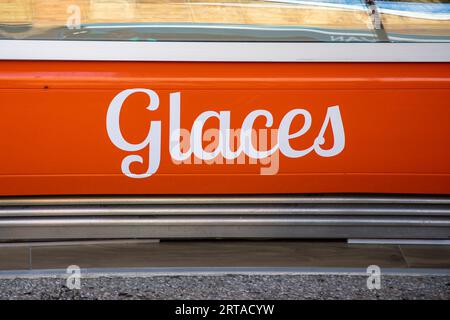 glaces french text means ice cream sign facade store front of wall shop ...