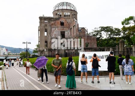 People visit the Atomic Bomb Dome in the city of Hiroshima, western ...