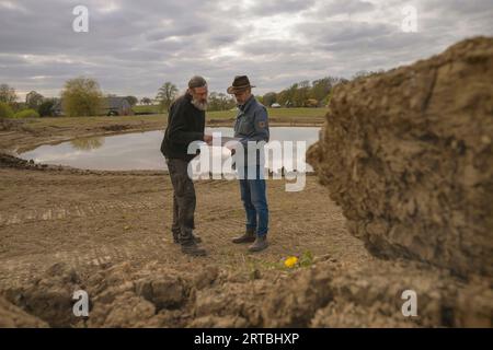 Biotope for amphibians is newly created, men control the construction ...