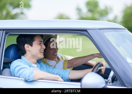 Japanese men driving Stock Photo - Alamy