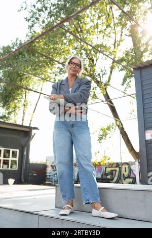 Photo of excited pretty lady dressed denim shirt looking empty space ...