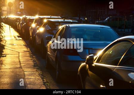 A line of cars on the roadside in Tatabanya Stock Photo - Alamy