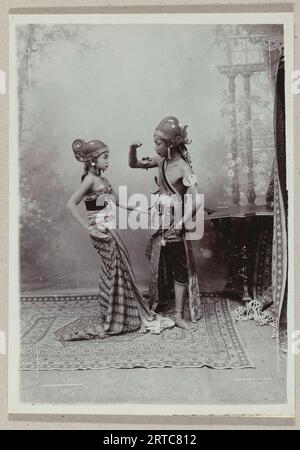 Studio Portrait of two Javanese dancers in traditional clothing and ...