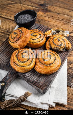 Traditional Nordic baked sweet breads on a wooden board. Breakfast food ...