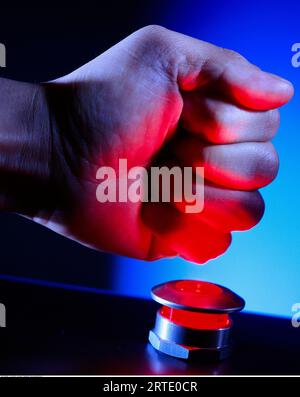 Hand pushing a red buzzer Stock Photo - Alamy