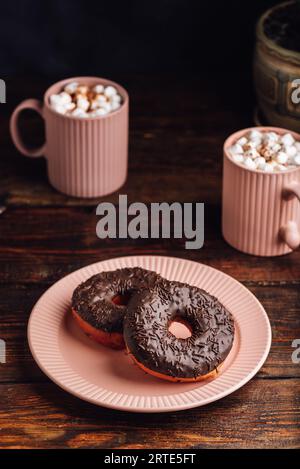 Two Chocolate Donuts and Mug of Hot Chocolate with Marshmallow on ...