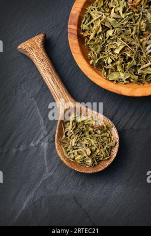 Dried rue leaves in the spoon - Ruta graveolens Stock Photo - Alamy