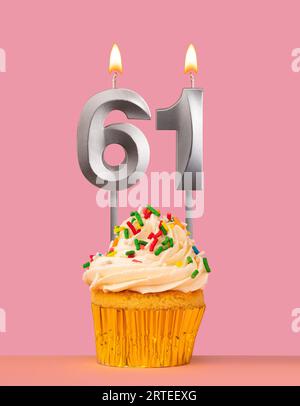 Birthday card number 61 - Cupcake with balloons Stock Photo - Alamy