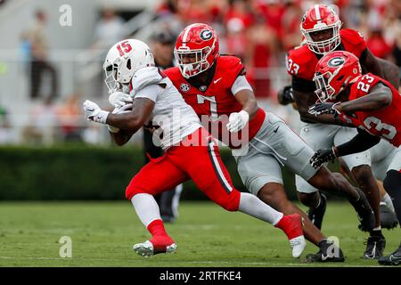 Ball State running back Marquez Cooper (15) escapes from Georgia ...
