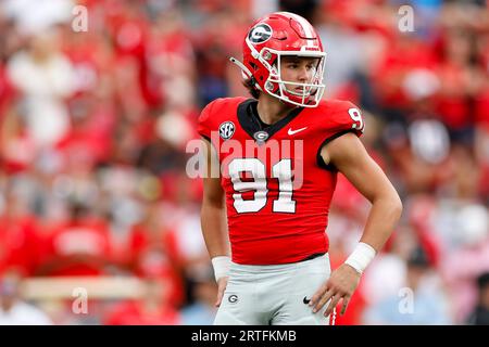 Georgia kicker Peyton Woodring (91) kicks a field goal from the hold by ...