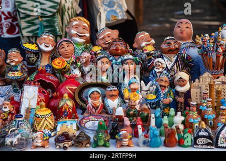 Ceramic figures of Uzbek old men in traditional clothes. Uzbekistan ...