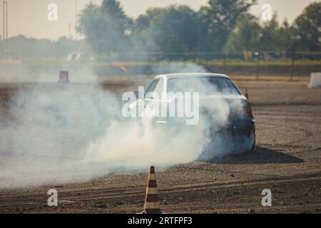 High-octane car drift race captured amidst swirling smoke, showcasing ...