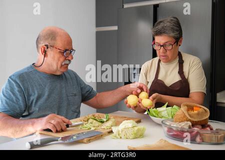 Mature Spanish couple cooking cocido, typical Spanish dish Stock Photo ...