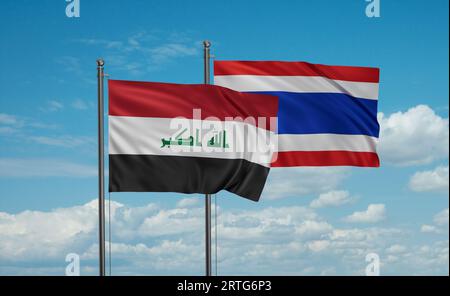 Kingdom of Thailand and Iraq flags waving together in the wind on blue ...