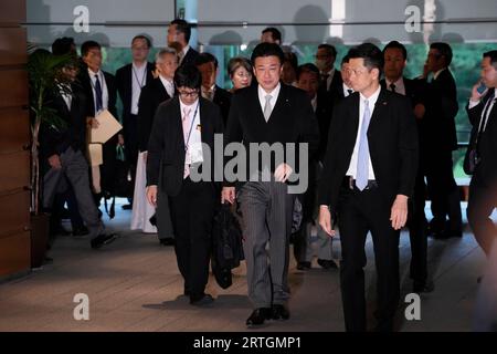 New Japanese Defense Minister Minoru Kihara (R) attends an attestation ...